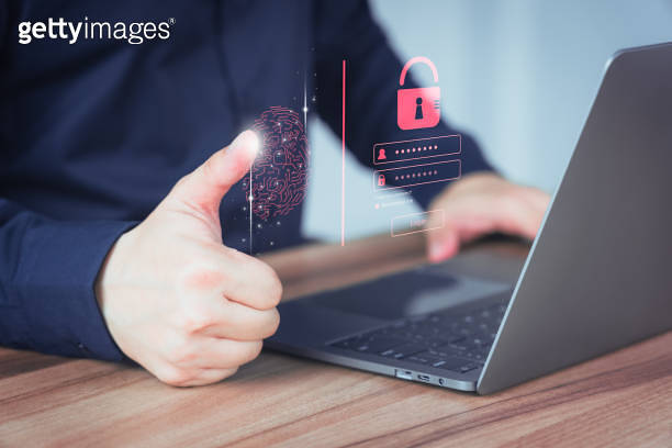 Young man log in with fingerprint scanning technology in the computer ...