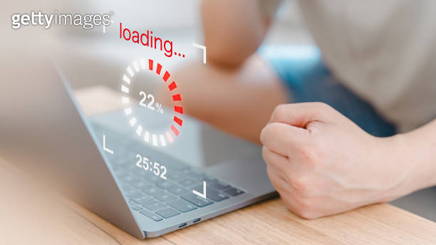 User use a laptop computer to download and update software with waiting ...