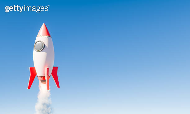 Rocket flying high in the blue sky (1746174393) - 게티이미지뱅크