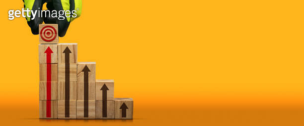 Gloved Hand Arranging Wood Blocks as Step Stair and Target Symbol 이미지 ...