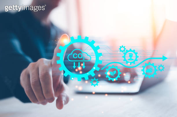 Hand touching CO2 reducing icon in concept of decrease carbon dioxide ...