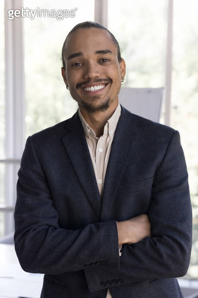 Happy handsome African businessman, business coach, executive, CEO ...