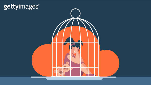 Little girl locked in an iron cage. A sad girl is locked up in a cage ...