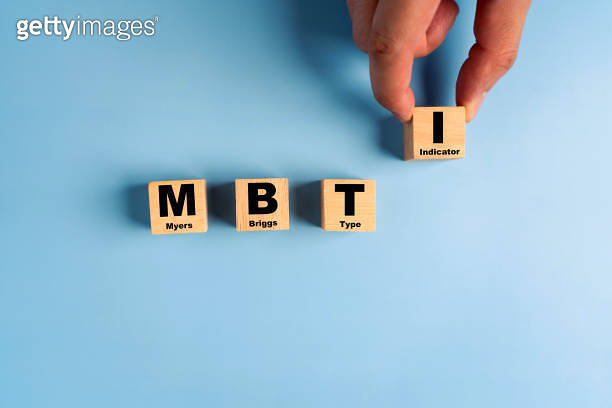 Wooden blocks with the letters MBTI on blue background. Personality ...