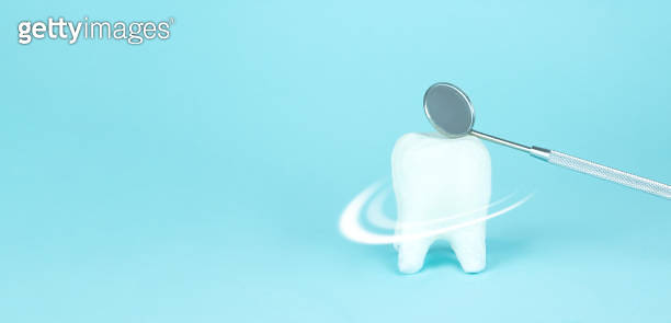 Whitening of human tooth, white shining tooth and dentist mouth mirror ...