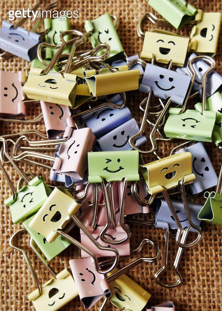 Pastel colored Office Paper Clips, Smiley Binder Clips, and Pencils on ...