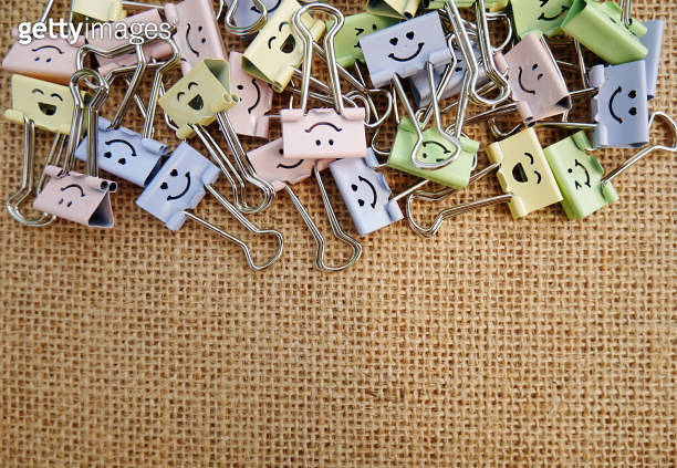 Pastel colored Office Paper Clips, Smiley Binder Clips, and Pencils on ...