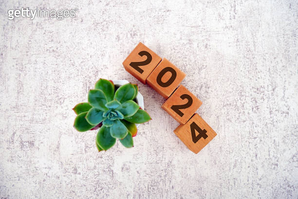 New Year 2024. Numbers on wooden cube blocks stacked on brick ...