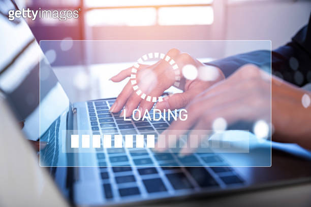 Business woman hands on computer keyboard keys. Loading message on ...