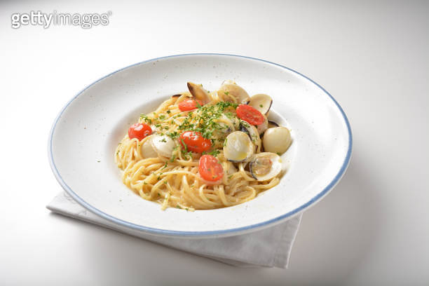 stir fried olive oil mixed seafood clam shell pasta in aglio olio style ...