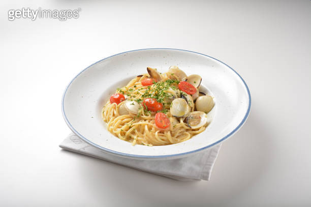 stir fried olive oil mixed seafood clam shell pasta in aglio olio style ...