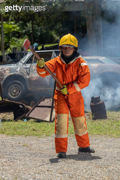 Firefighters wearing helmets with fire safety equipment Use Twirl ...