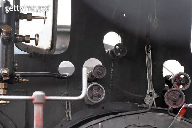 Macro shot showing the valves gauges and taps for controlling steam ...