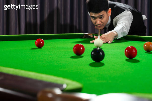 Asian man playing snooker, snooker club, Asian man playing snooker with ...