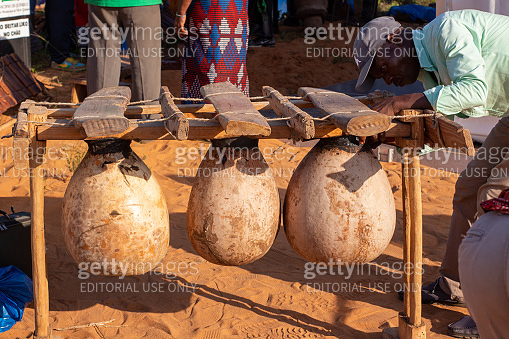 Skilled craftsman tune a traditional wooden xylophone-like instrument ...