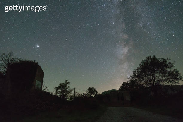 The Nightsky with stars and Milky Way over ruins of ghost town of ...