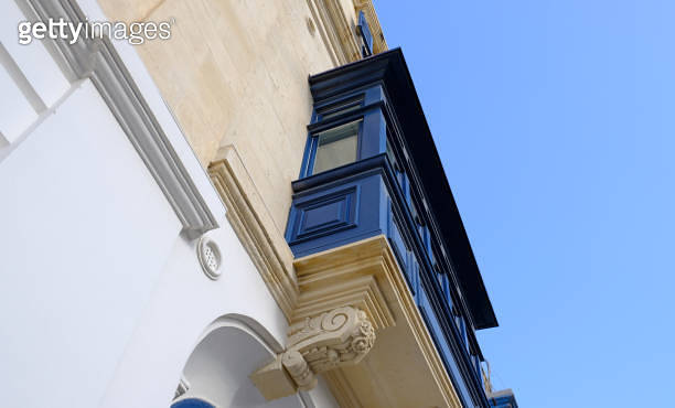 Exterior of typical maltese houses and colorful wooden balconies ...