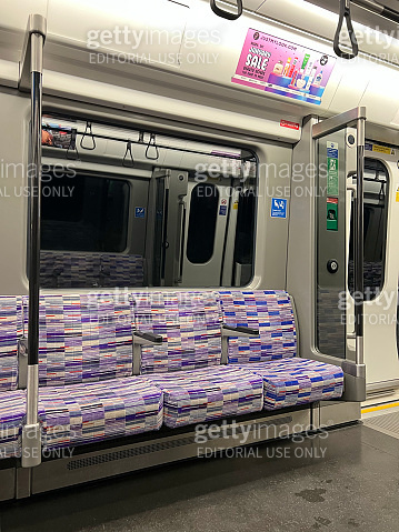 Purple chairs of an Elizabeth Line Underground train, London - January ...