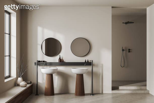 Front view on bright bathroom interior with double sink, shower ...