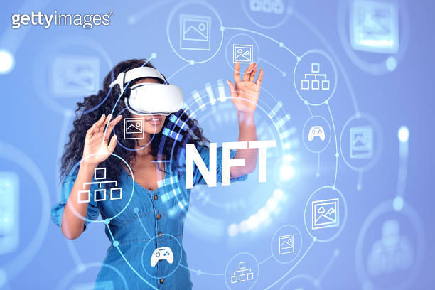 African woman in vr glasses finger touch NFT hologram with digital icons 이미지 (1455274148) - 게티이미지뱅크