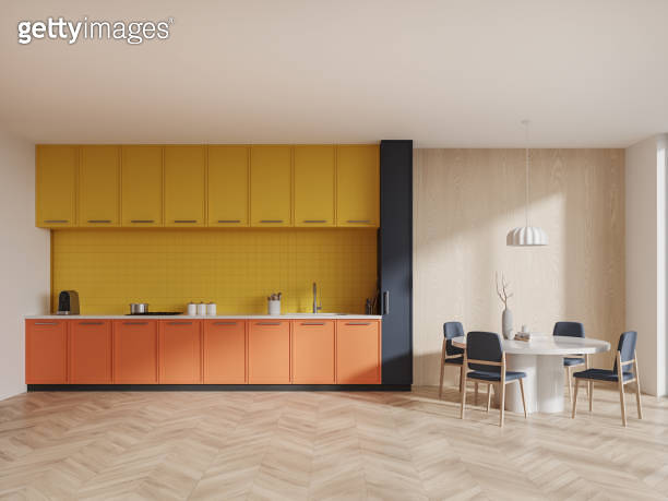 Cozy hotel kitchen interior with cooking and eating space, colorful ...