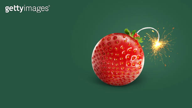 Delicious creative juicy strawberry bomb with wick and sparks burns on ...