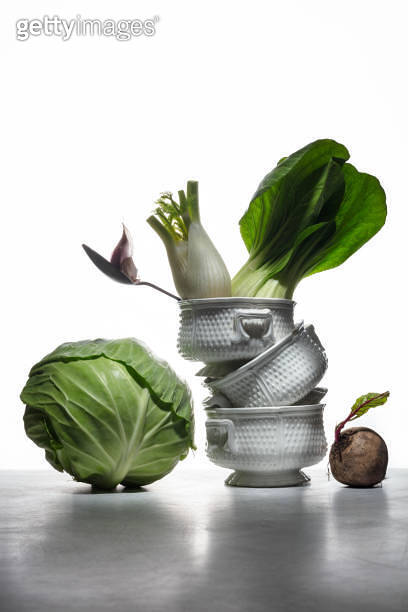 Variety of vegetables in a balancing dishes. Healthy food. (1728003447 ...