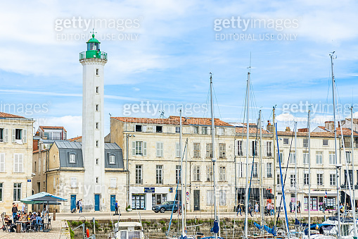 Green lighthouse of the Old Port of La Rochelle on the Quai Valin ...