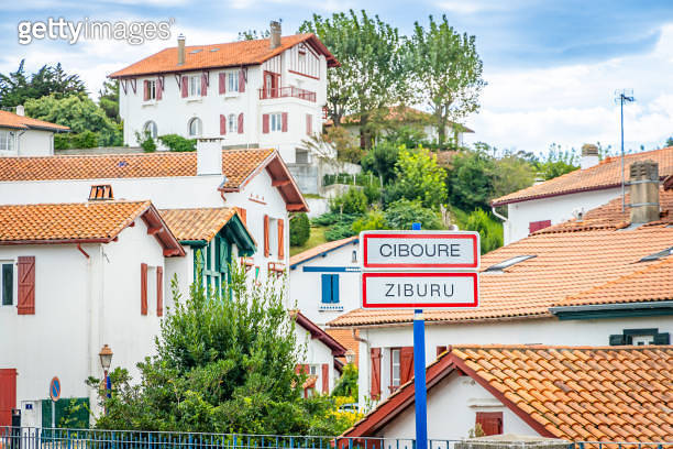 Bilingual French and Basque road sign at the entrance to Ciboure ...