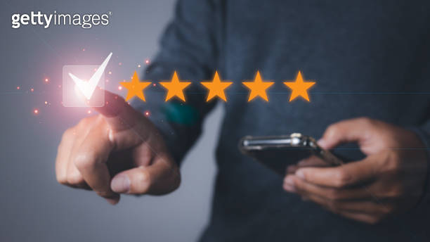 Man using phone giving high score with five star icon and excellent ...