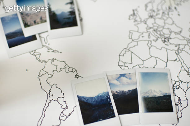 Polaroid Photos Layout of Mountains on Travel World Map (1460547374 ...