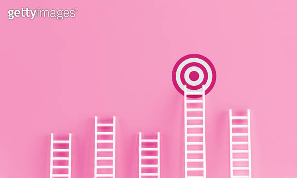 Pink Ladder achievement on pink wall studio background. aspirations ...
