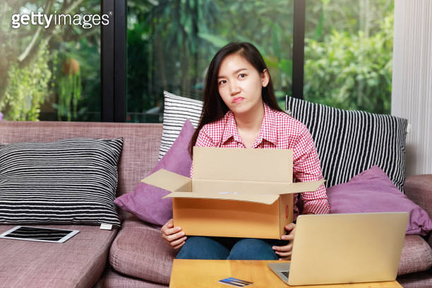 Woman feel disappointed after received damaged item or unwanted stuff ...