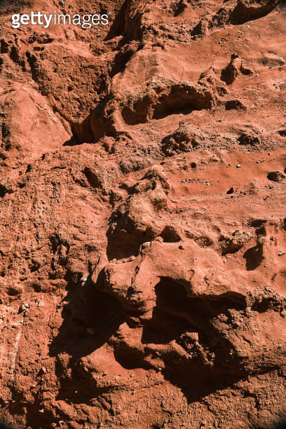 Texture of terracotta red rock 이미지 (1731536560) - 게티이미지뱅크