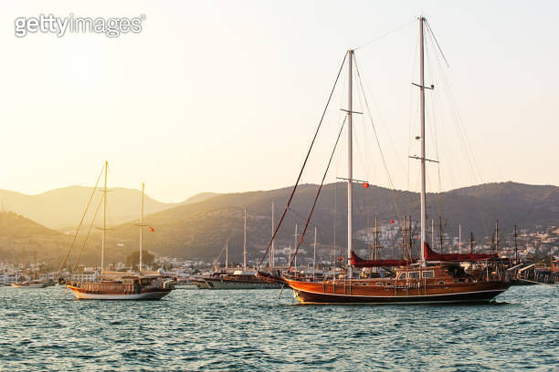 Bodrum cruise port with sailing yachts at sunset. Beautiful view of ...