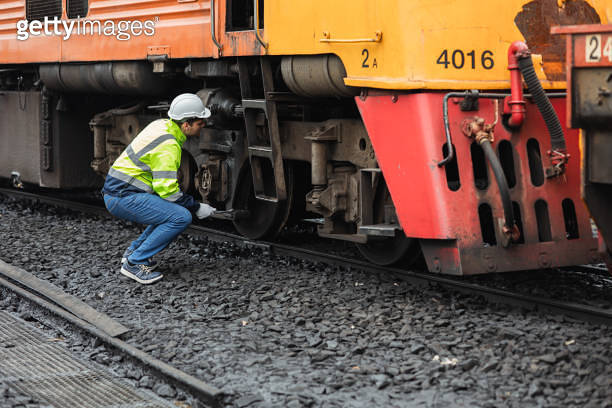 Locomotive repair worker, Train Engineer technician on duty working ...