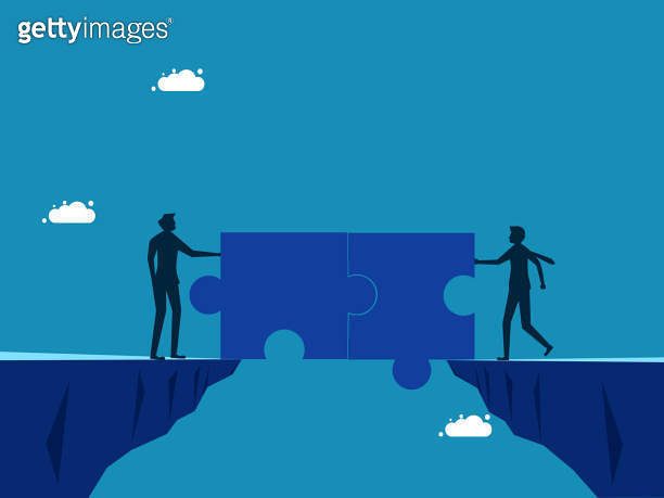 Solve problems together. Two businessmen connect a jigsaw puzzle ...