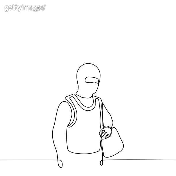 man in balaclava in body armor with a big bag on his left shoulder ...