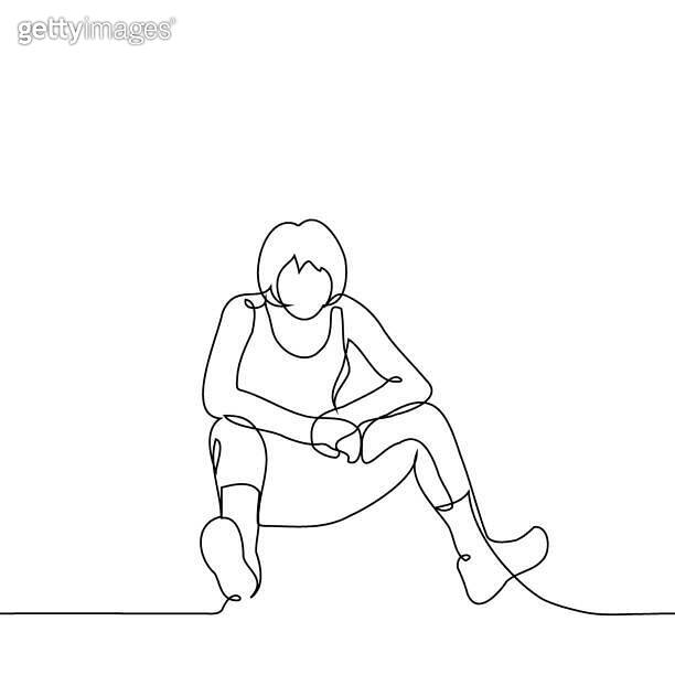Woman Sits On The Floor With Her Legs Spread Wide Elbows On Her Knees And Palms Together One