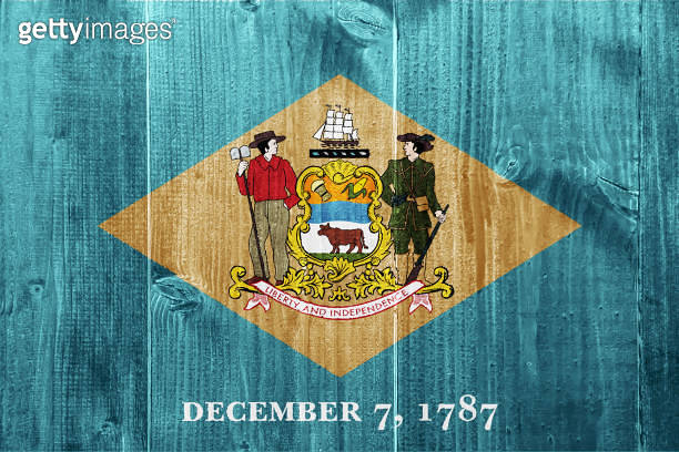 Flag and coat of arms of Delaware USA state on a textured background ...