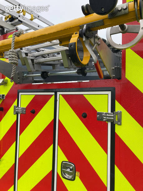 Rear view of a fire tender / pump showing bright coloured cheverons and ...