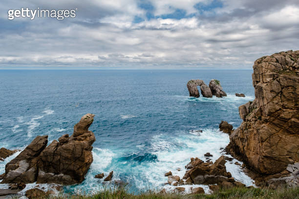 Spectacular coastal landscape with steep cliffs and rock formations ...