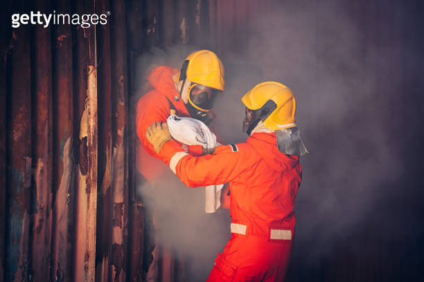 Firefighter in Action, Protecting People from Fire and Smoke. Fearless ...