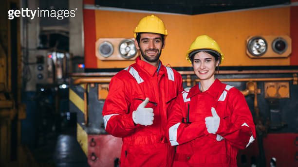 Portrait of Industrial engineers using walkie-talkie for check up ...