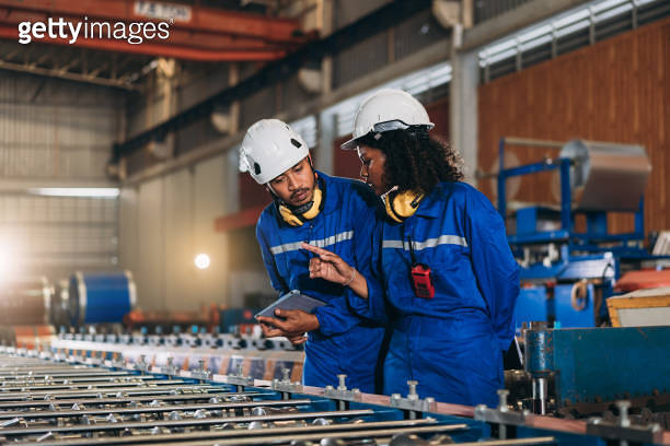 Foreman checking Material or Machine. Industrial worker inspecting and ...