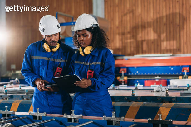 Foreman checking Material or Machine. Industrial worker inspecting and ...