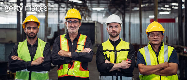 Portrait of Group of Team Mechanical Engineers at Factory Machines ...
