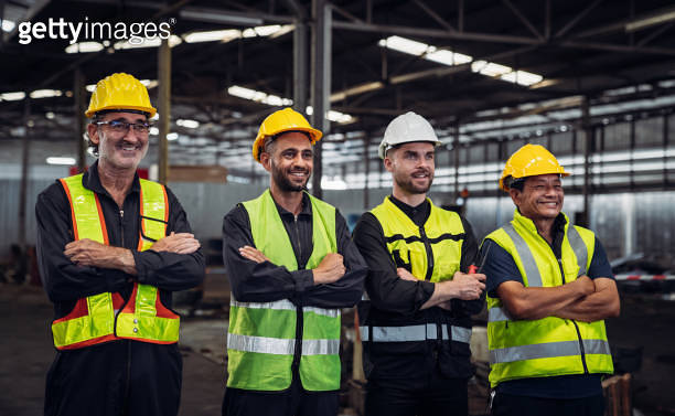 Portrait of Group of Team Mechanical Engineers at Factory Machines ...