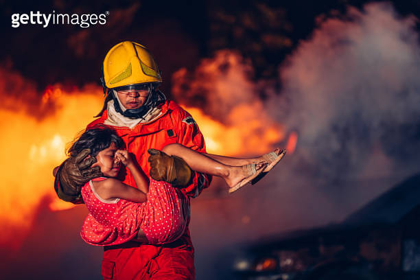 Firefighter in Action, Protecting People from Fire and Smoke. Fearless ...