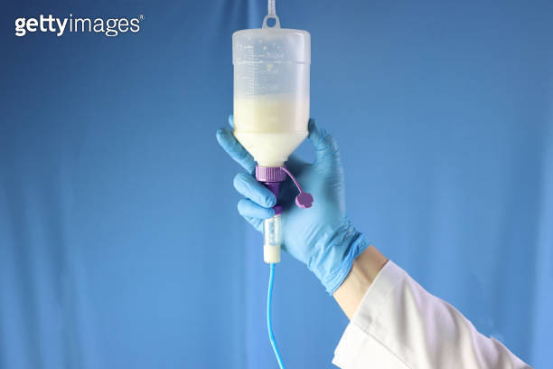 Enteral nutrition diet bottle hanging and infusing enteral diet ...